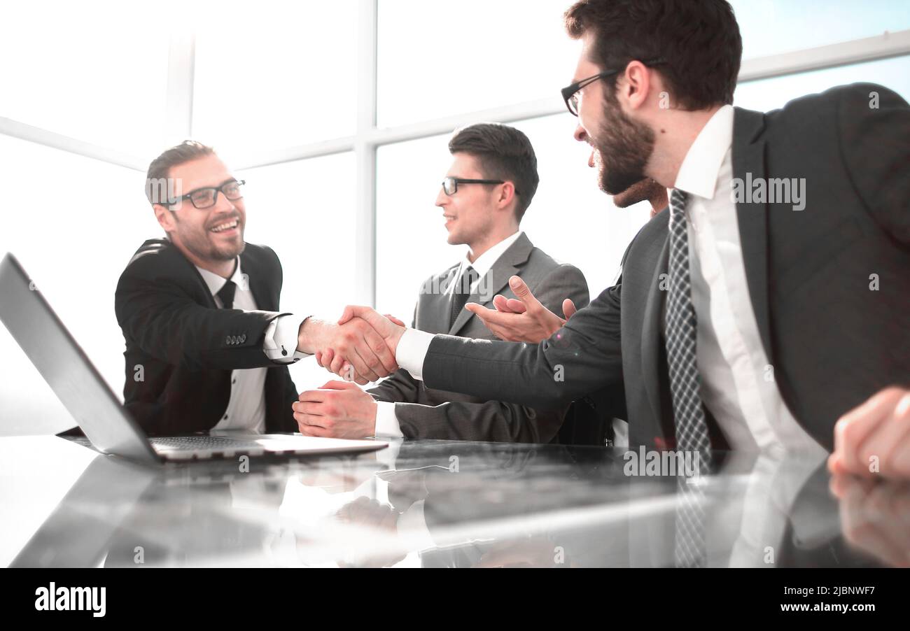 welcome handshake business partners in the office Stock Photo - Alamy
