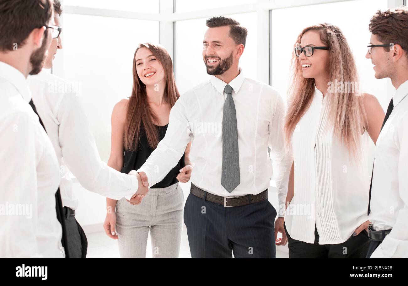 handshake of young business partners in the office Stock Photo - Alamy