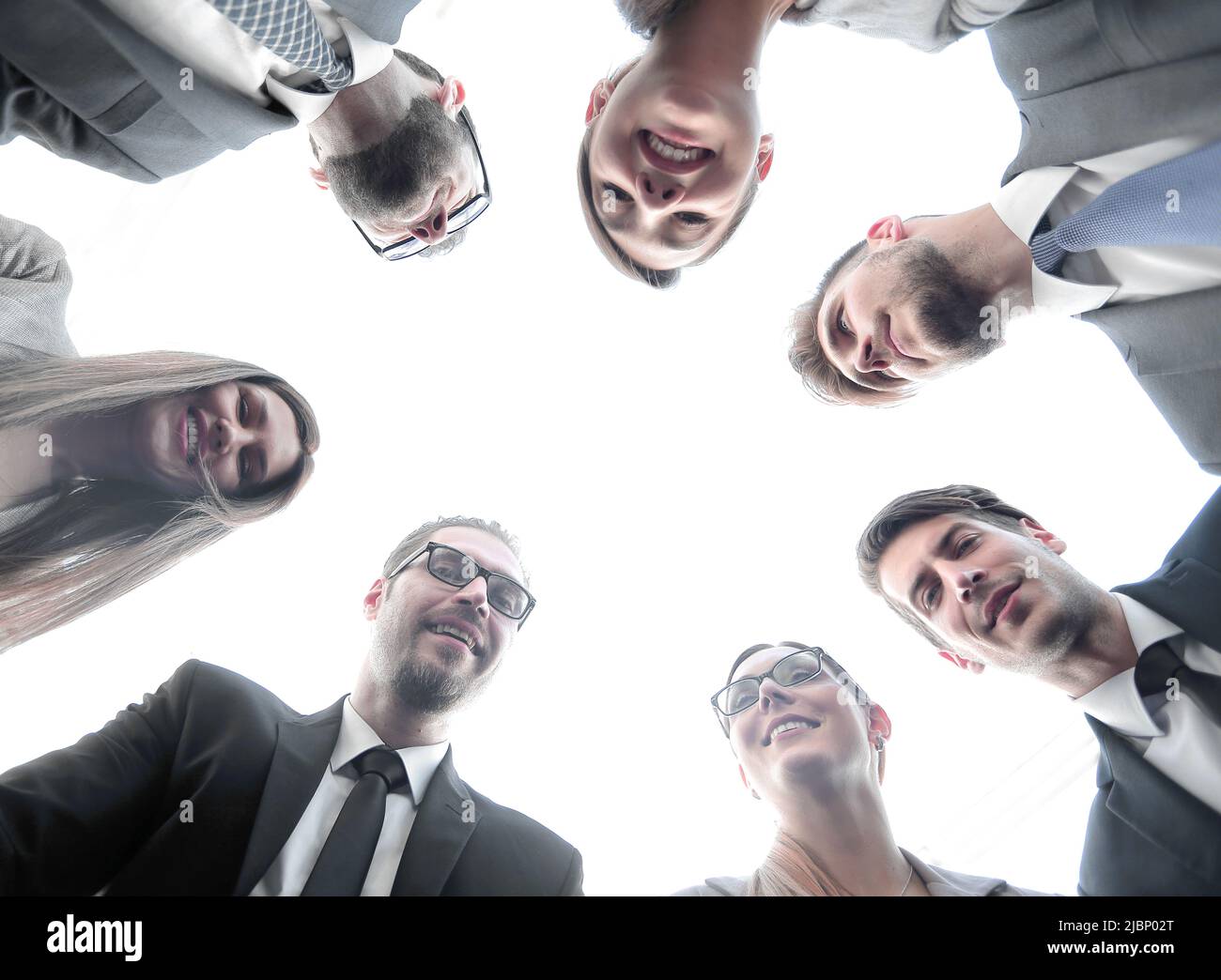 bottom view.a group of employees stands forming a circl Stock Photo - Alamy