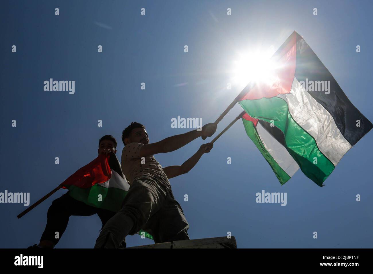 Gaza, Palestine. 07th June, 2022. Palestinians protesters wave the ...