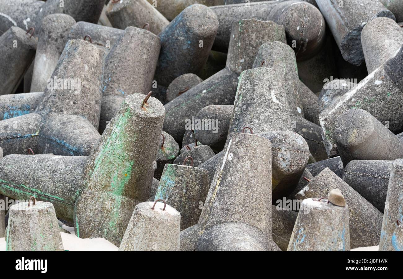 Concrete breakwaters made of tetrapod blocks. Breakwater on the beach ...