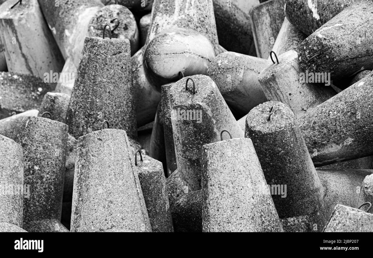 Concrete breakwaters made of tetrapod blocks. Breakwater on the beach ...