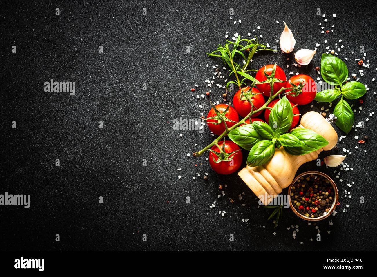 Food cooking background on black stone table Stock Photo - Alamy