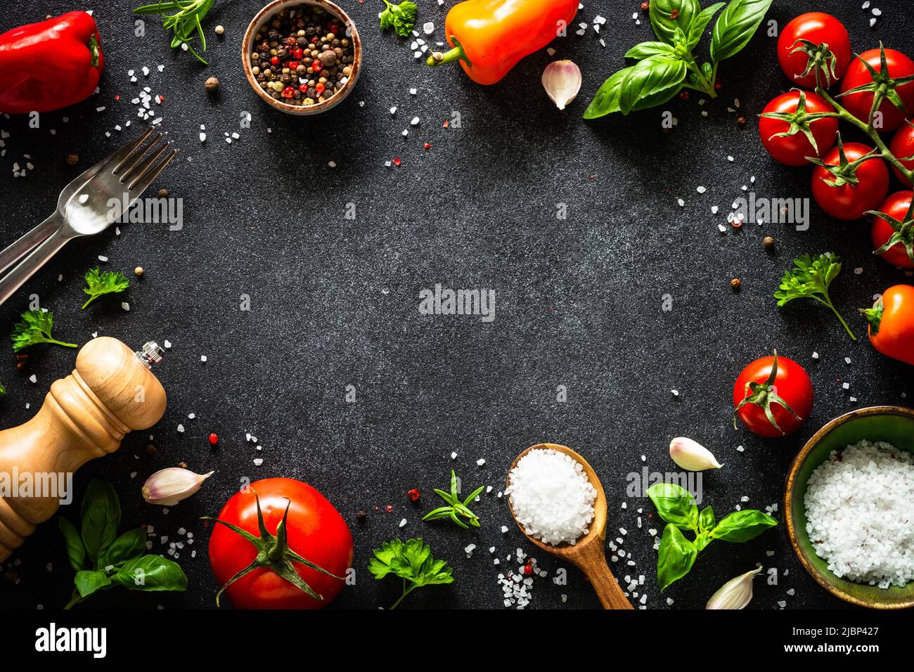 Food cooking background on black stone table Stock Photo - Alamy