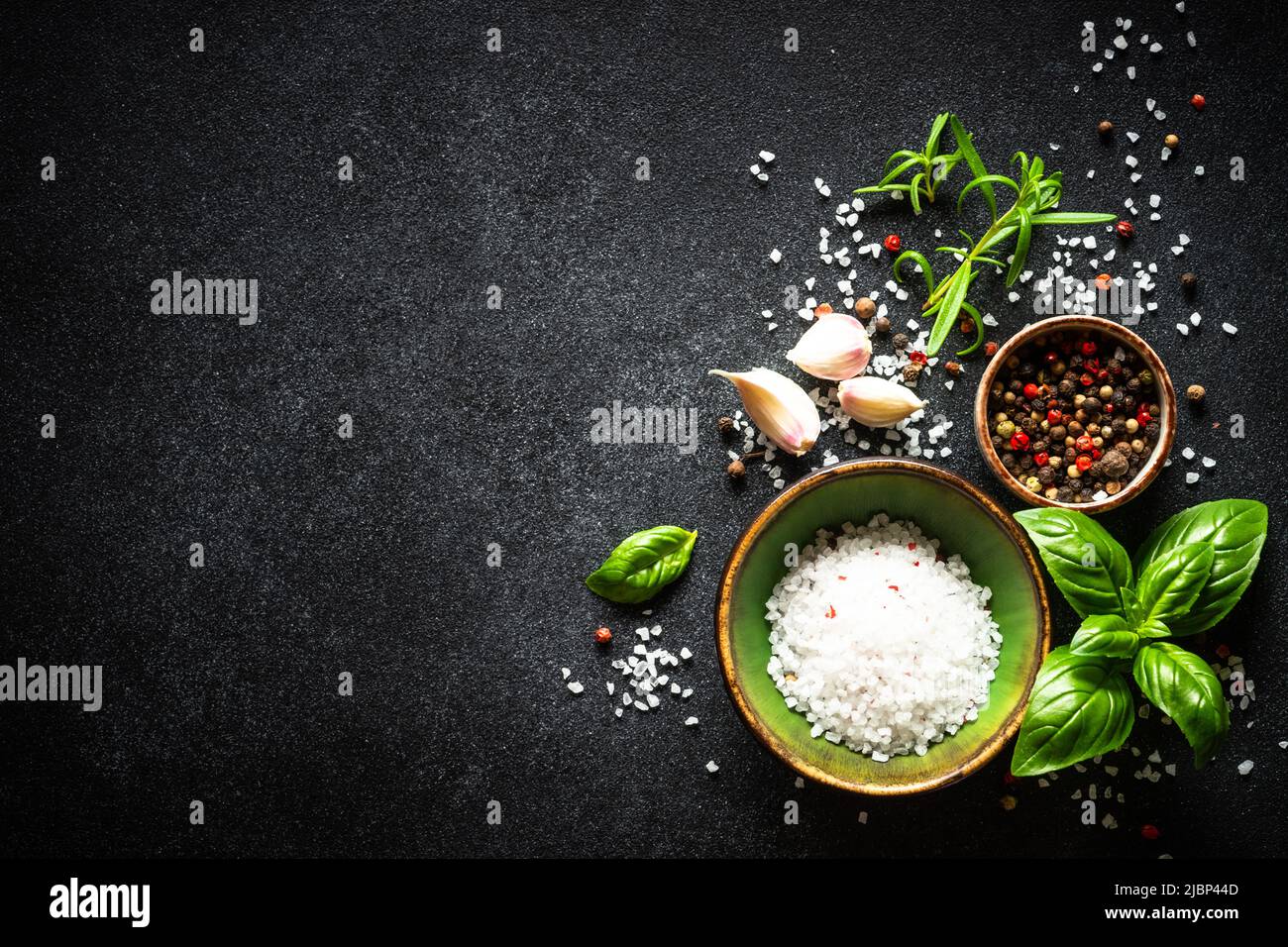 Food cooking background on black stone table Stock Photo - Alamy