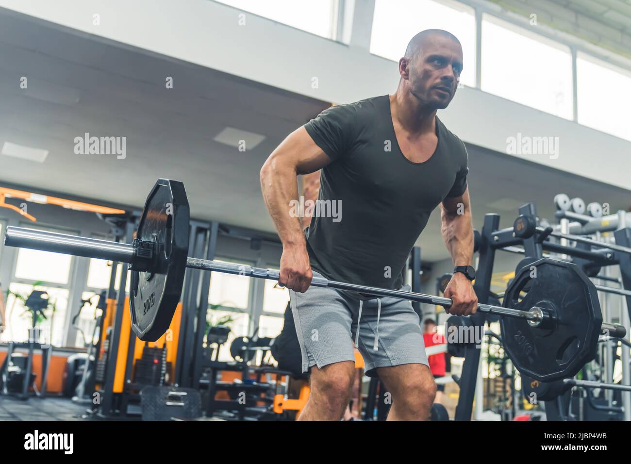 Strong man exercising gym muscular sport hi-res stock photography and ...
