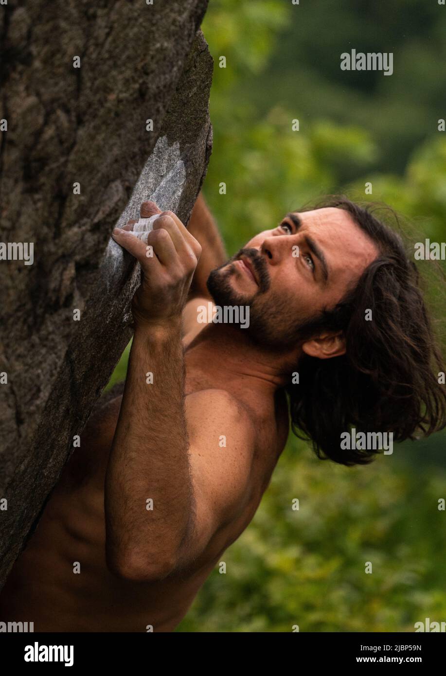 Hanging on the rock Stock Photo - Alamy