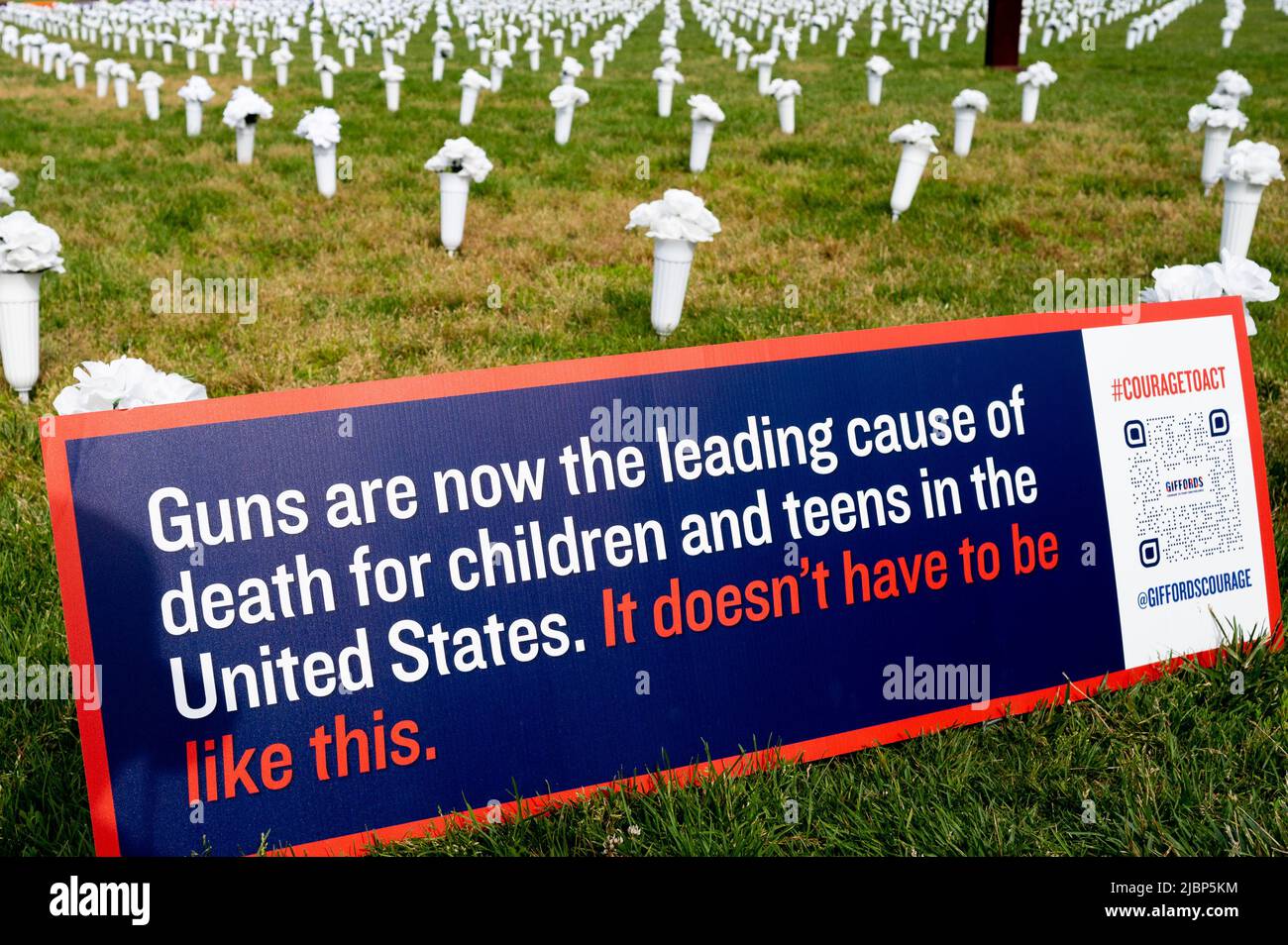 A sign saying "The Gun Violence Memorial remembers victims of gun ...