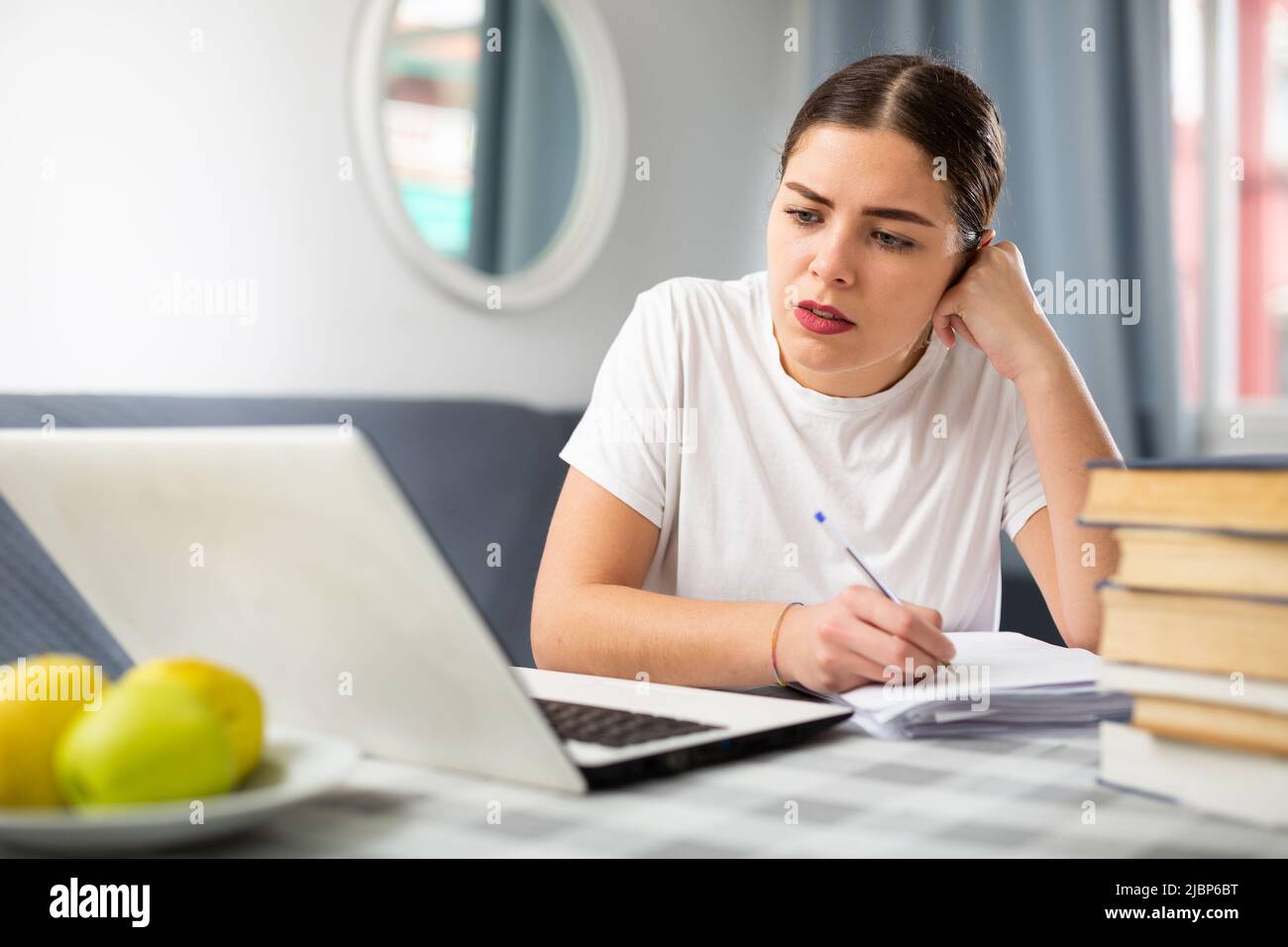 Young tired woman studying during online courses Stock Photo - Alamy