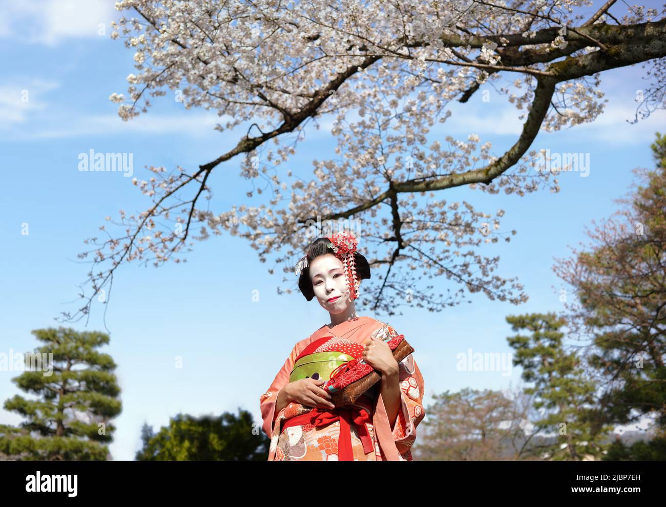 Low angle photography of a Japanese female maked up with a white face ...