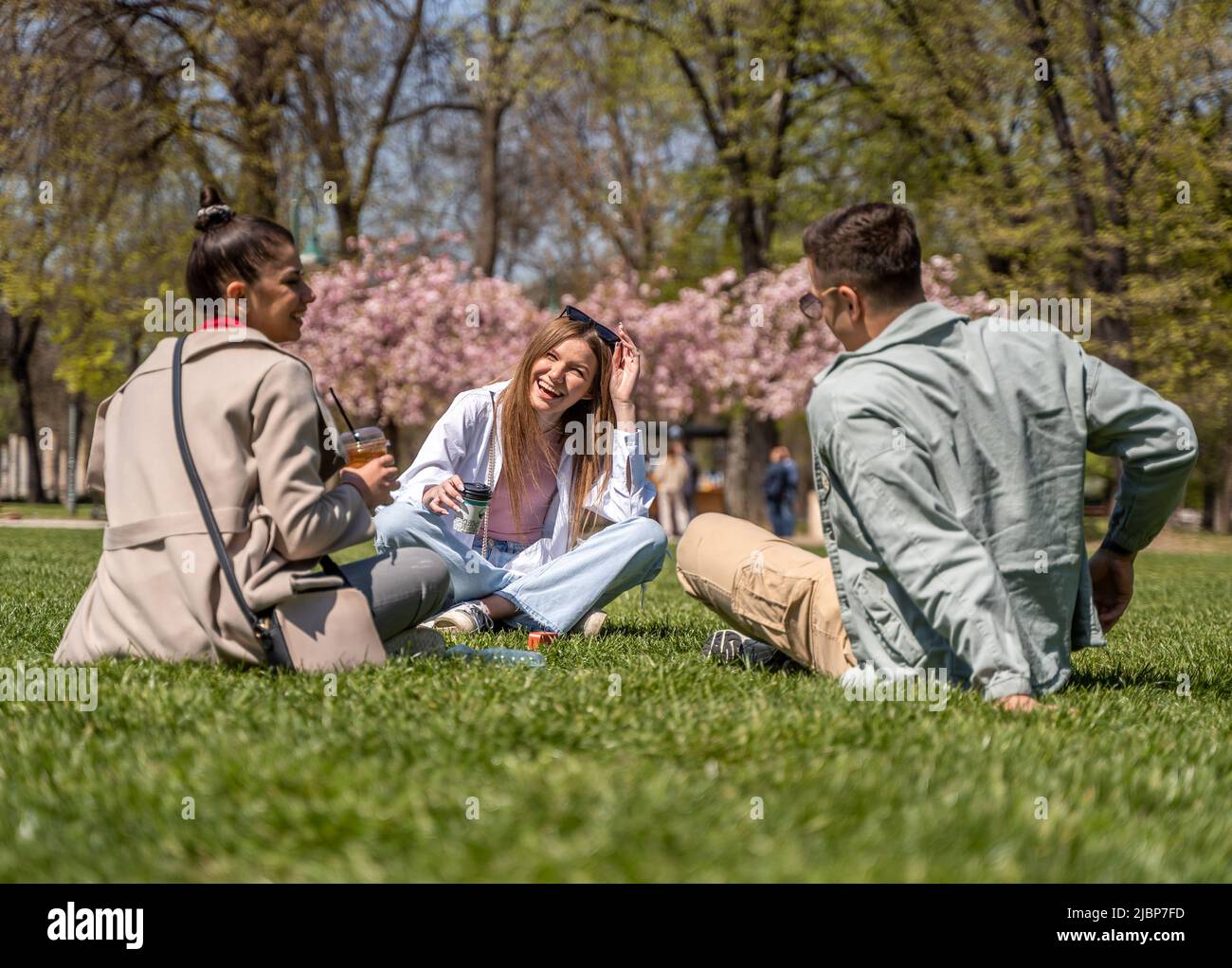 Group of young attractive smiling students dressed casual having fun on ...