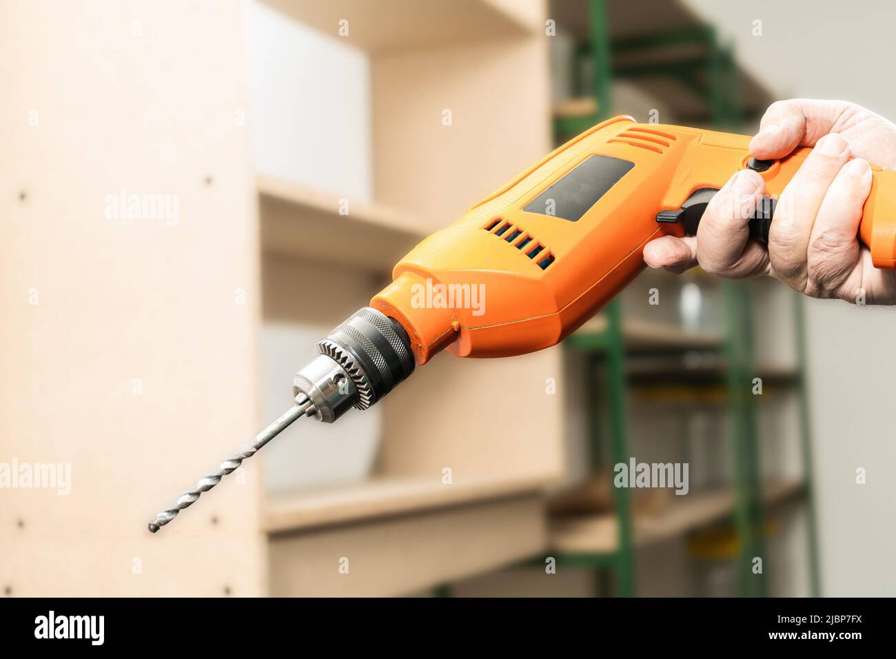 Construction holding cordless drill hi-res stock photography and images ...