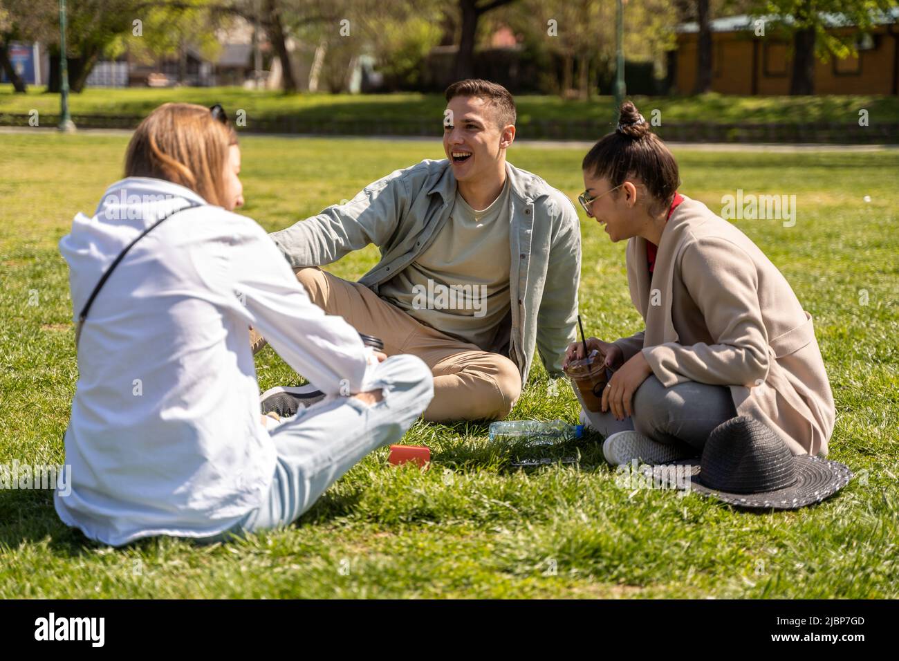 Stylish group of people enjoying in beautiful summer time while ...