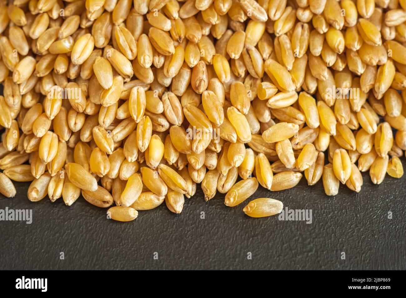wheat grain texture background closeup Stock Photo - Alamy