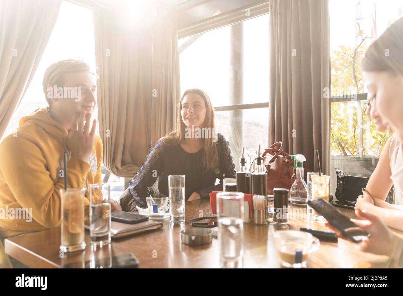 Group of young business people are laughing and having fun together while being on the meeting ...