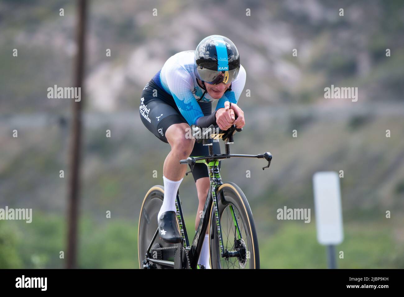 Amateur and pro cyclists compete during the time trial stage of the ...