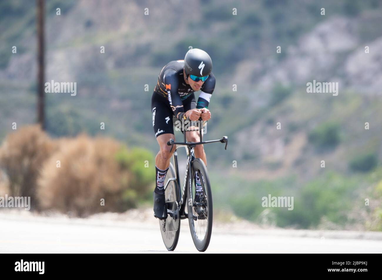 Amateur and pro cyclists compete during the time trial stage of the ...