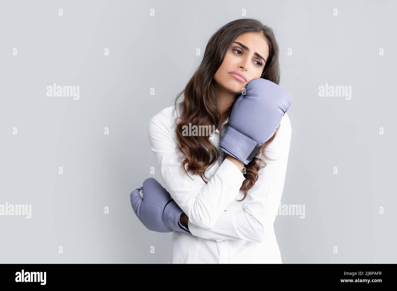 Sad tired woman in boxing gloves. Girl boxer posing with gloves Stock ...