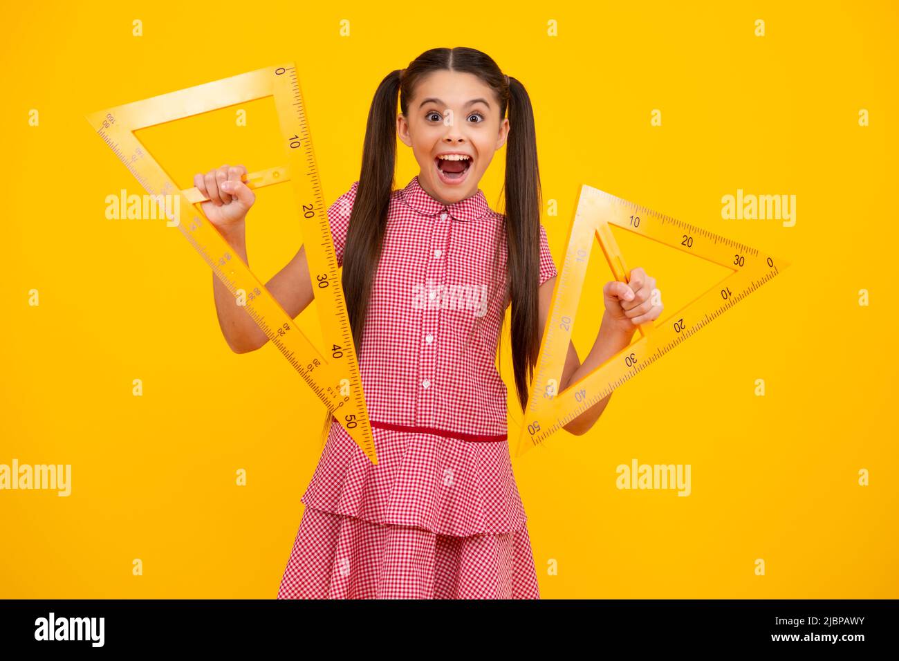 Teenager child school girl holding measure for geometry lesson ...