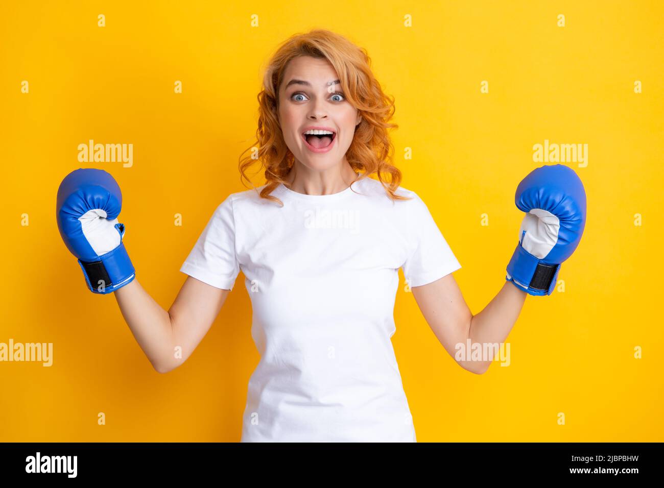 Girl fight for success. Winner female boxer with her hands raised ...