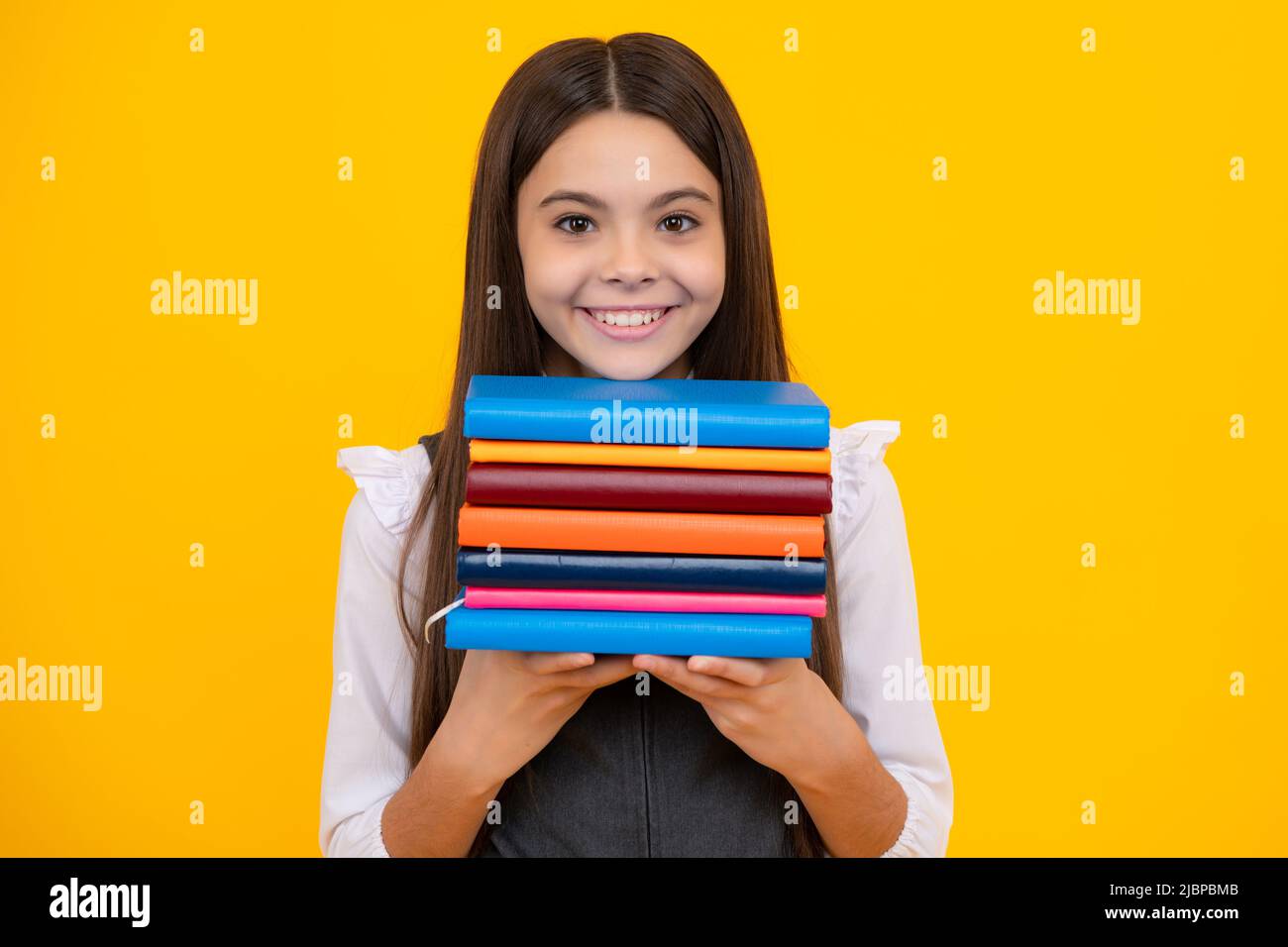 Schoolgirl with copy book posing on isolated background. Literature ...