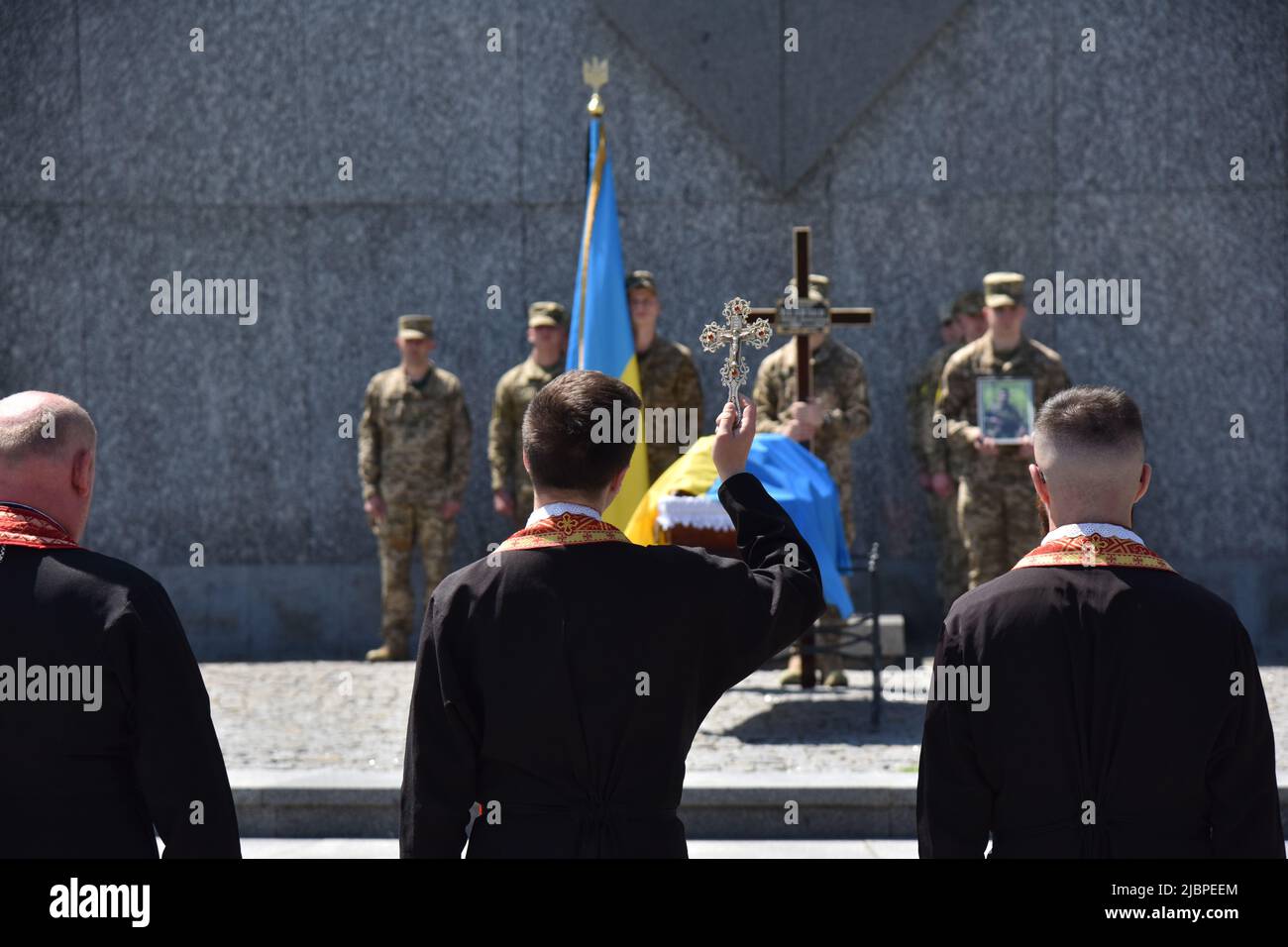 Lviv, Ukraine. 07th June, 2022. A priest holds a cross during the farewell ceremony of the ...