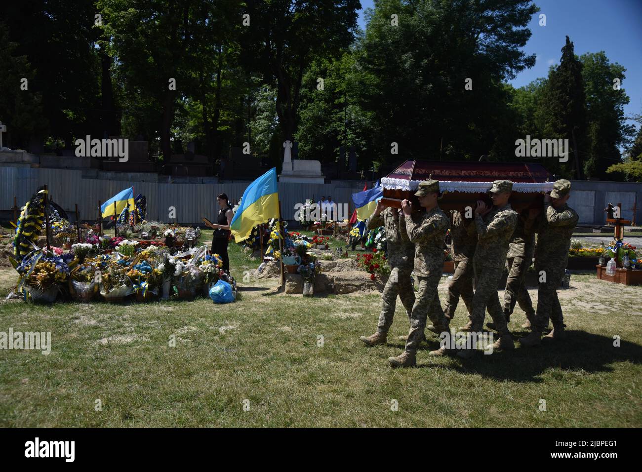 Lviv. Ukraine, 07 Jun 2022 Ukrainian military carry the coffin with the body during the farewell ...