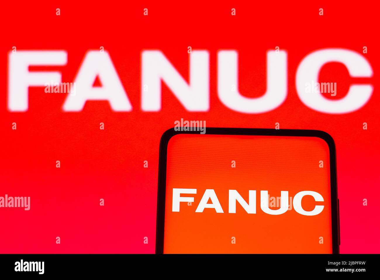 In this photo illustration, the FANUC Robotics logo is displayed on a ...