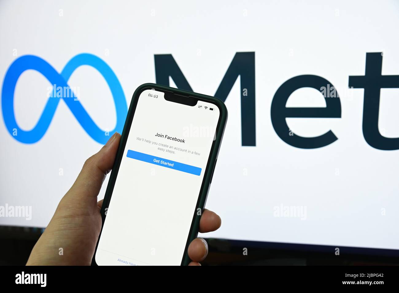 Facebook application on Apple iPhone 13 Pro, holding smartphone with ...