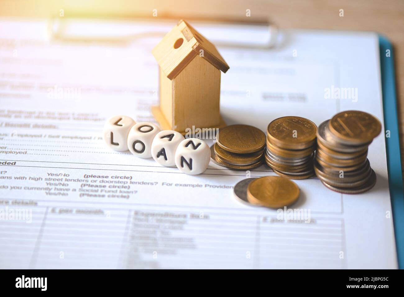 Home loan concept, Loan application form paper with money coin and loan ...