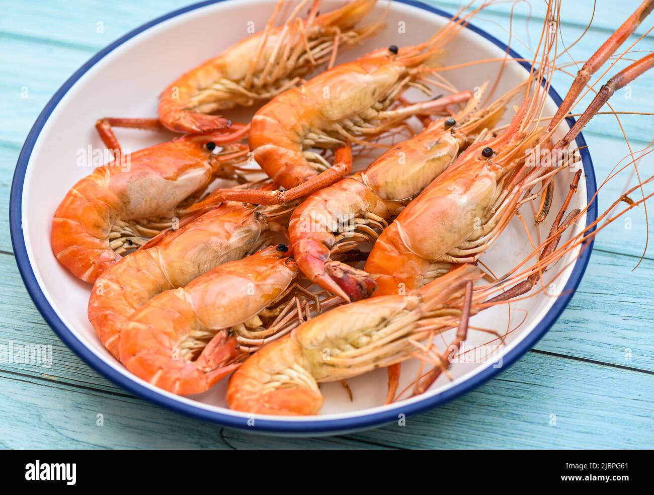 seafood plate fresh shrimp cooking on white plate background , shrimps ...