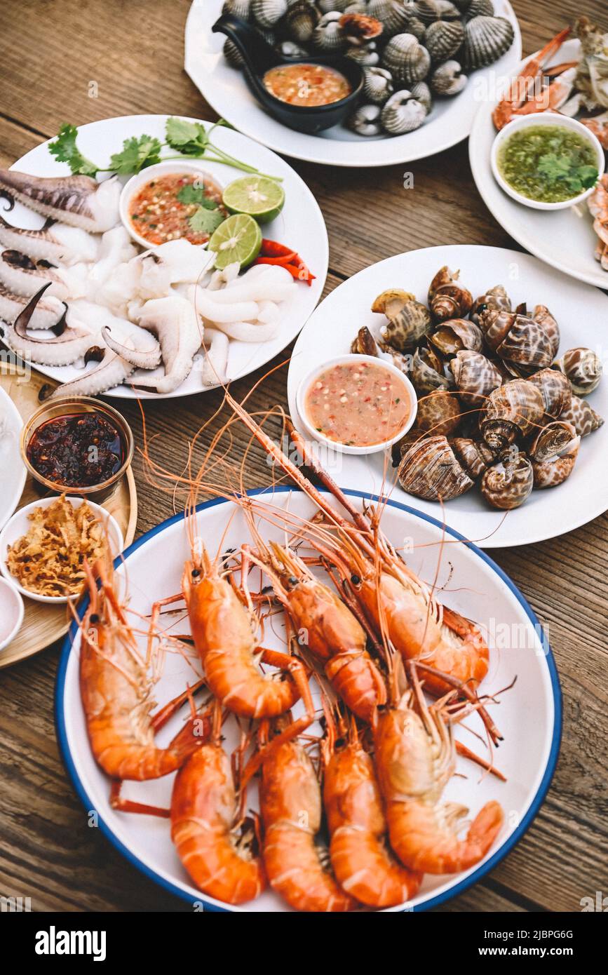 seafood plate with shrimp shellfish crab squid cockle spotted babylon ...
