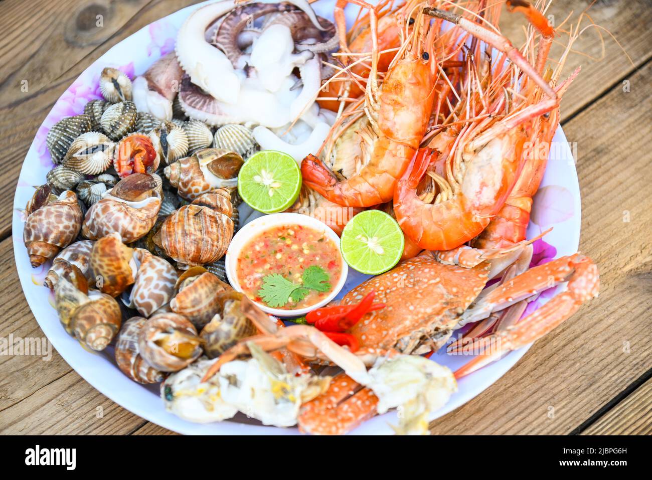 seafood plate with shrimp shellfish crab squid cockle spotted babylon ...