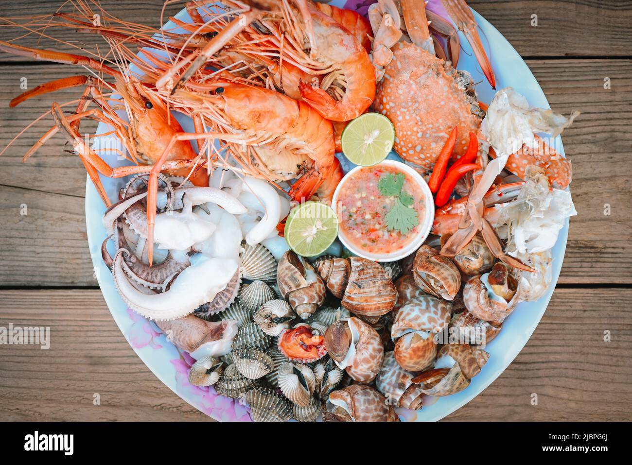 seafood plate with shrimp shellfish crab squid cockle spotted babylon ...