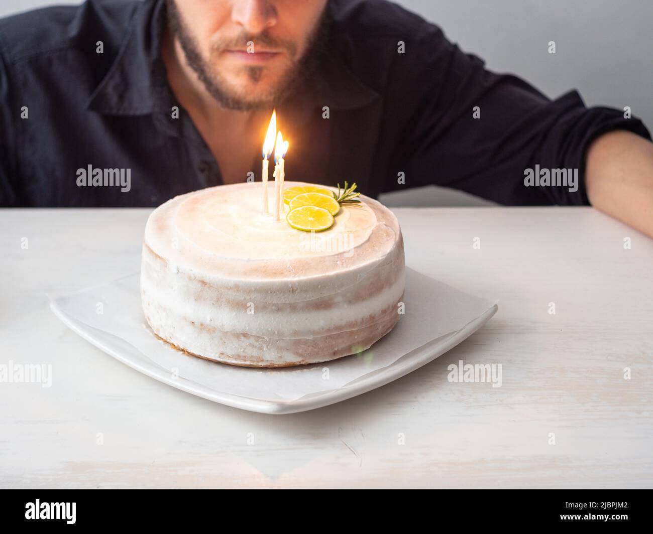White Man Looks the Candles on a Vegan Birthday Cake with Almond ...