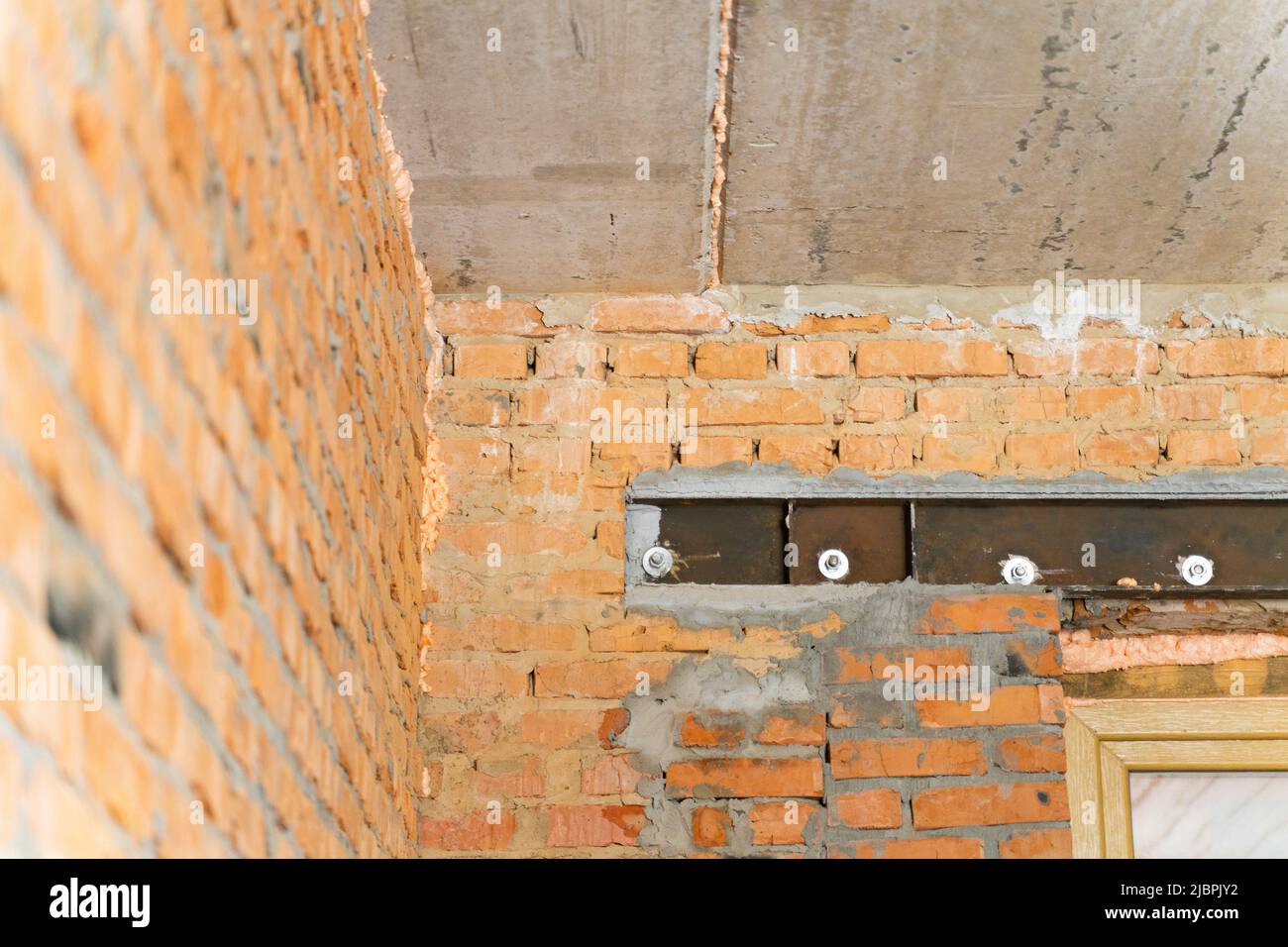 Reinforcement of interior openings with iron channels. Doorway in a ...