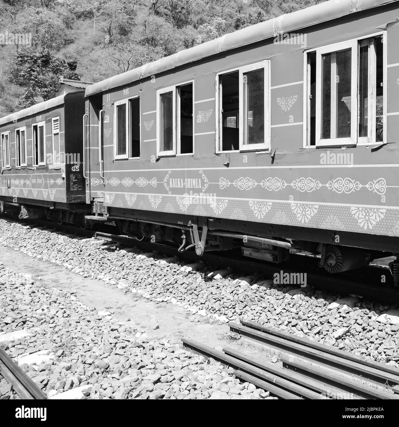 Toy Train moving on mountain slope, beautiful view, one side mountain ...