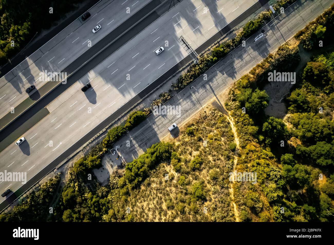 Multi-lane freeway with 6 lanes aerial photo with low traffic next to ...