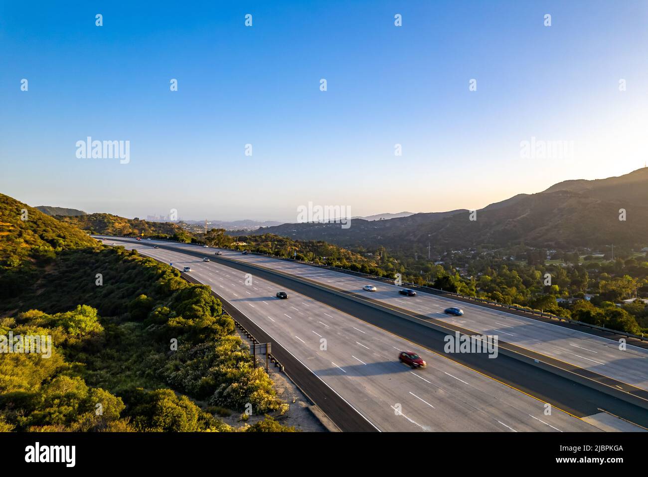 Multi lane freeway during sunset Stock Photo - Alamy