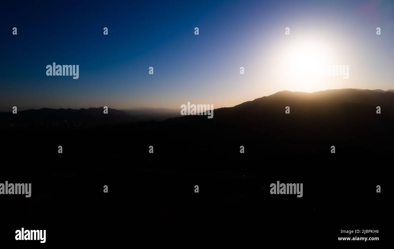 Sunset, hills and freeway Stock Photo - Alamy