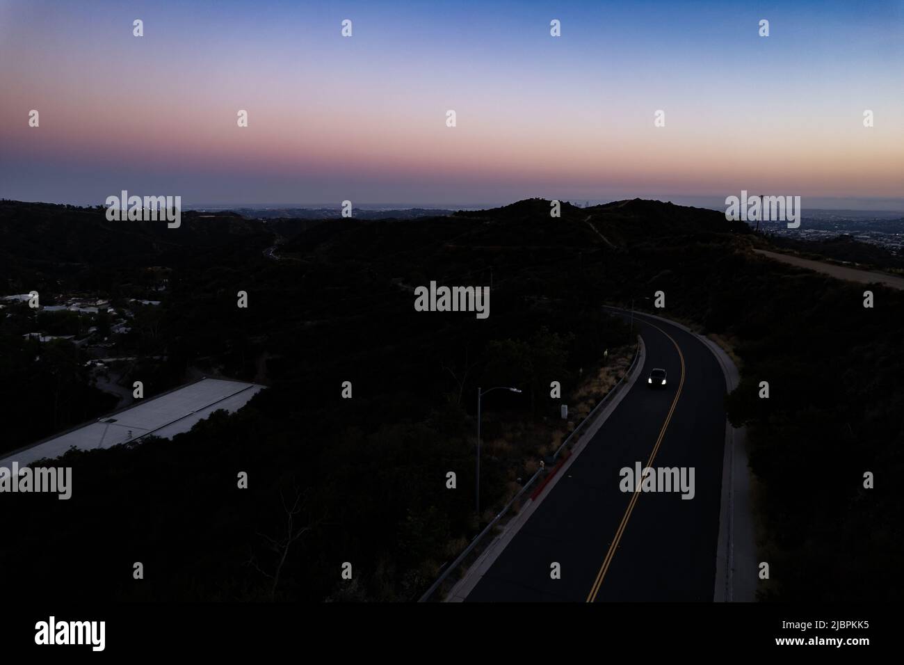Sunset, hills and freeway Stock Photo - Alamy