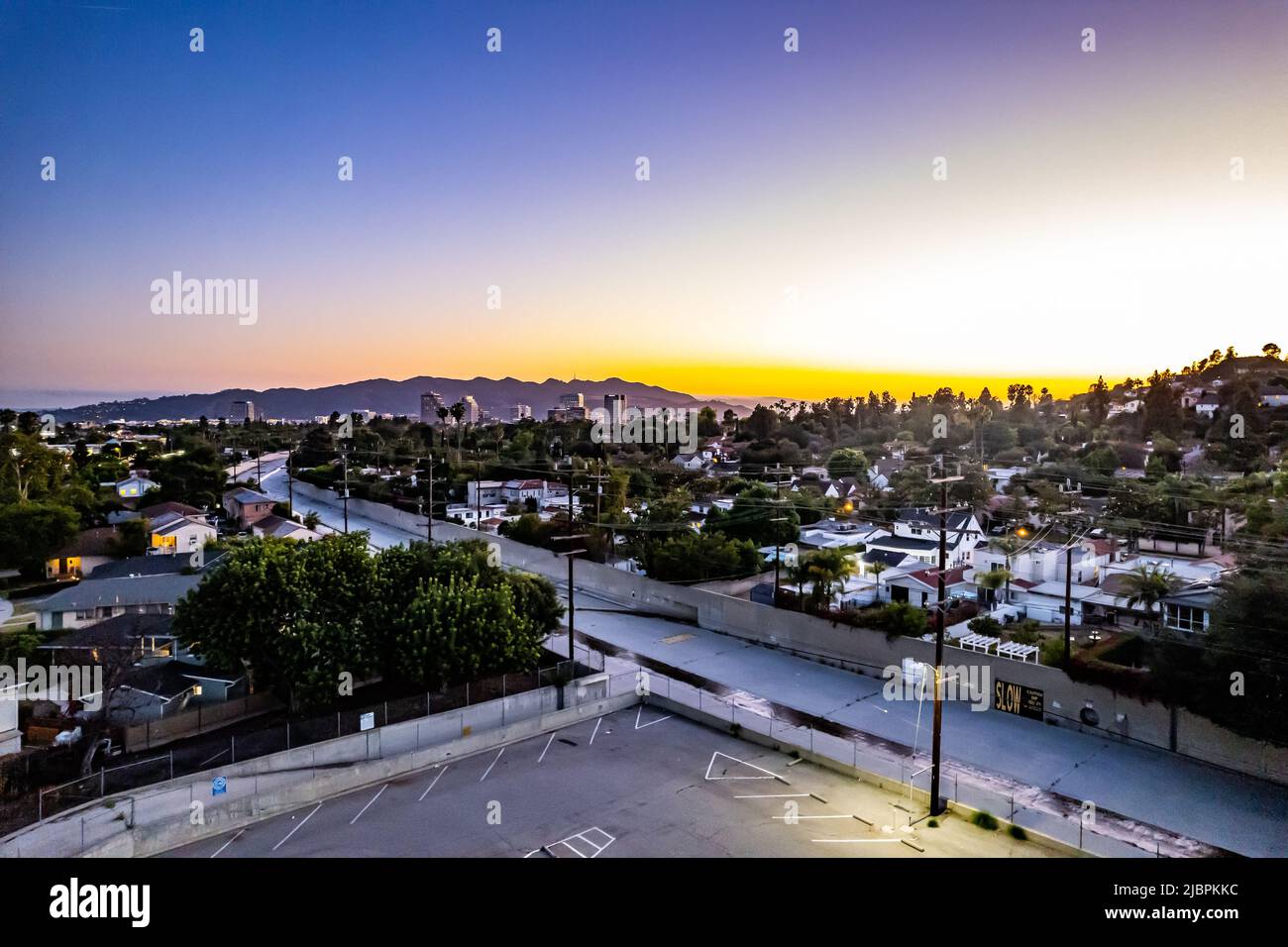 Sunset, hills and freeway Stock Photo - Alamy