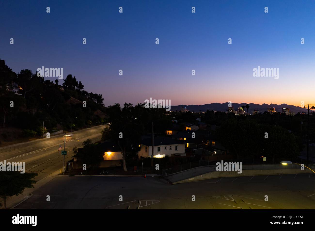 Sunset, hills and freeway Stock Photo - Alamy