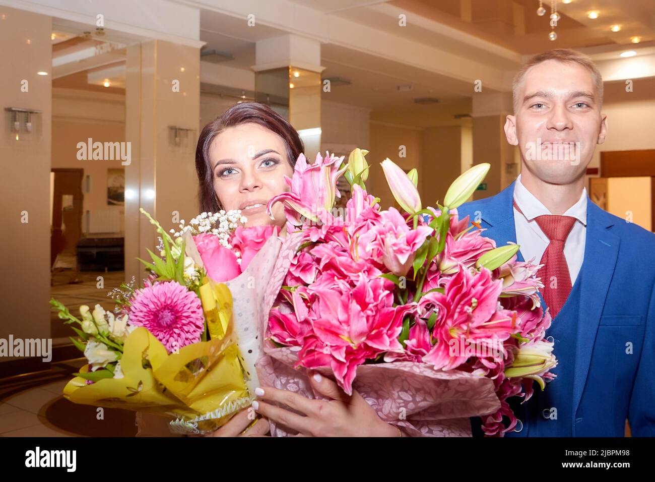 The bride and groom during beautiful marriage ceremony at the registry ...