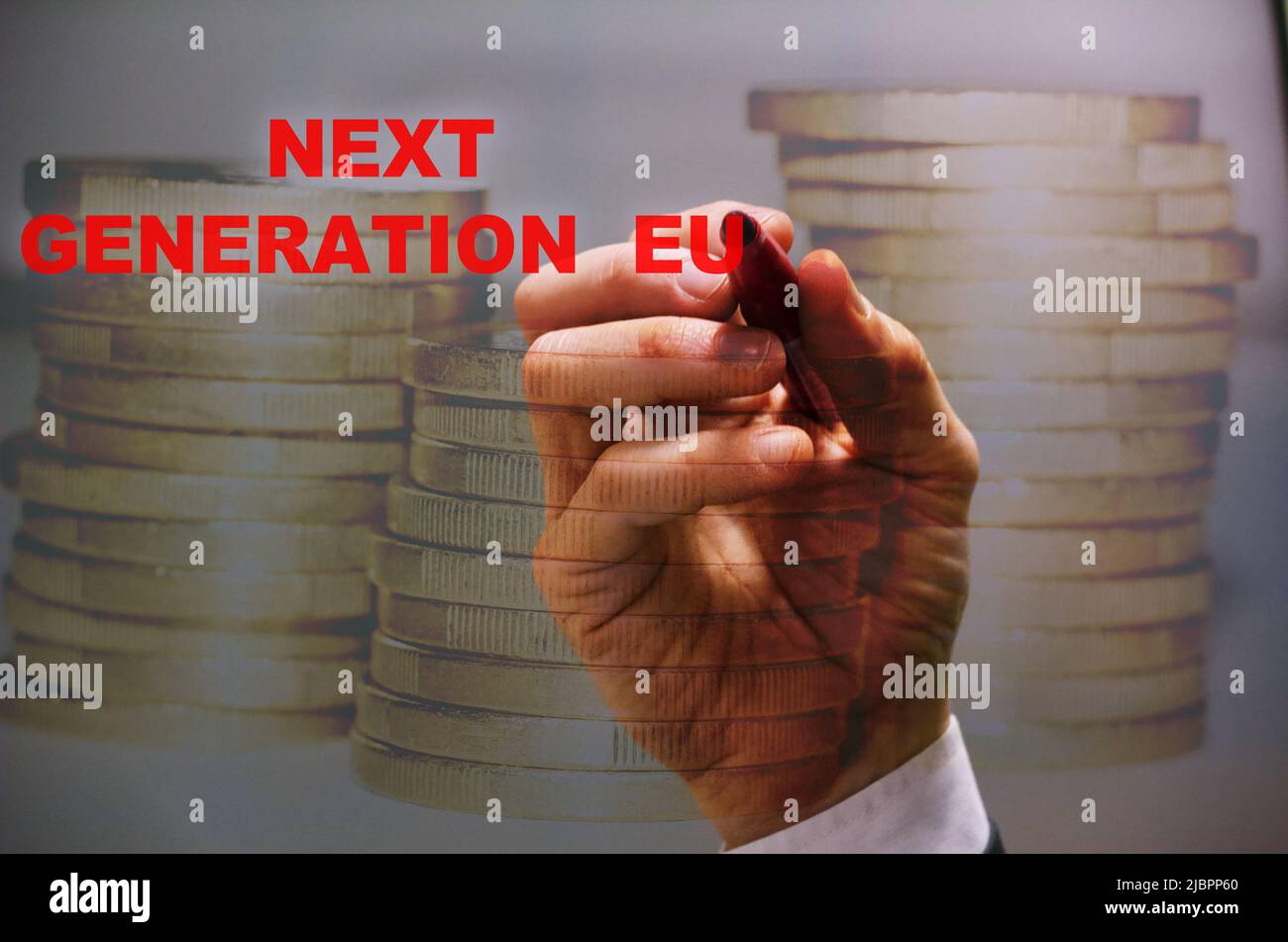 Hand writing the word "Next Generation Eu" with coins as background ...