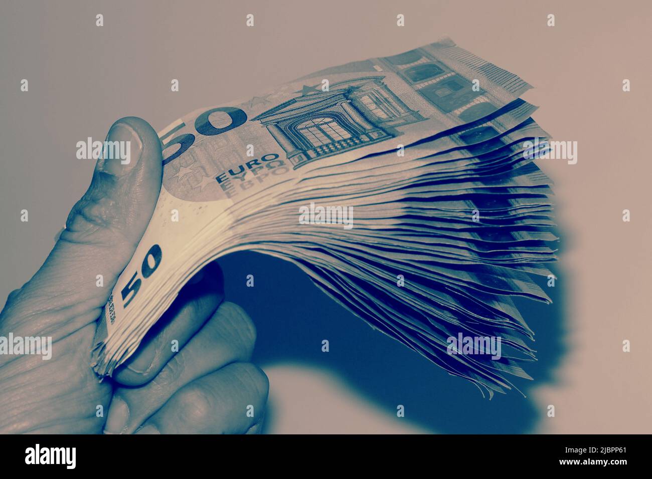 Hand holding banknotes hi-res stock photography and images - Alamy