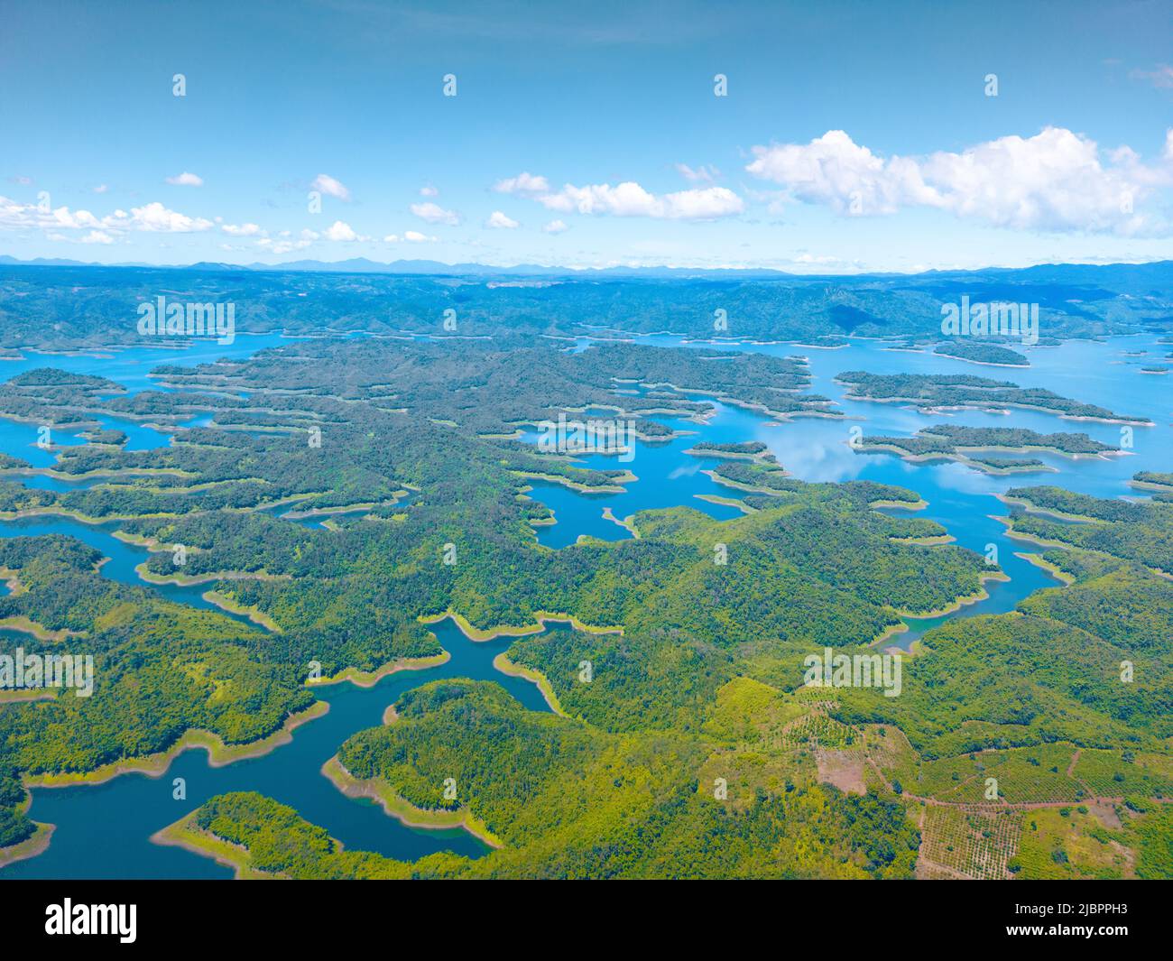 Morning at the Ta Dung lake or Dong Nai 3 lake with green hills and ...