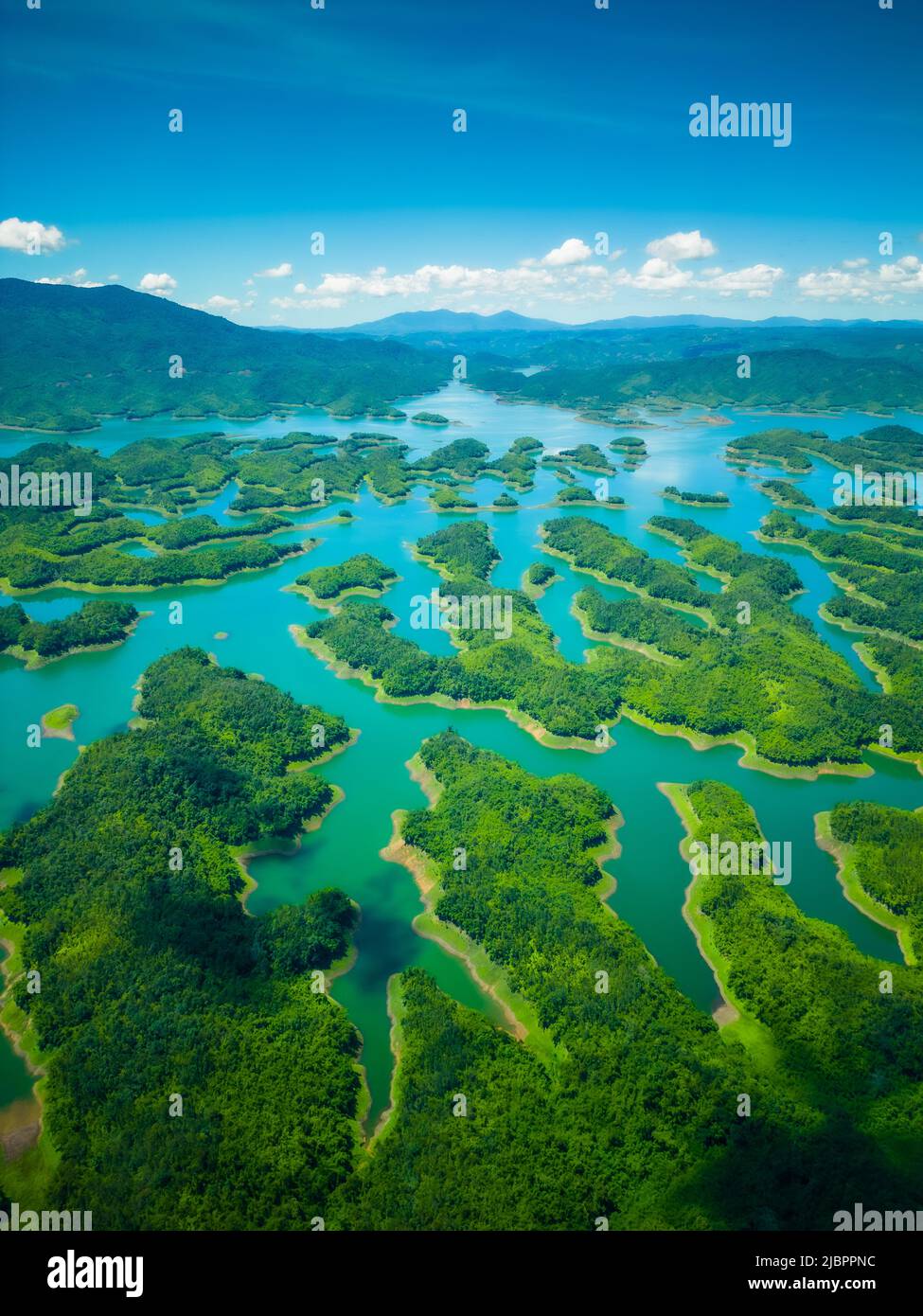 Morning at the Ta Dung lake or Dong Nai 3 lake with green hills and ...