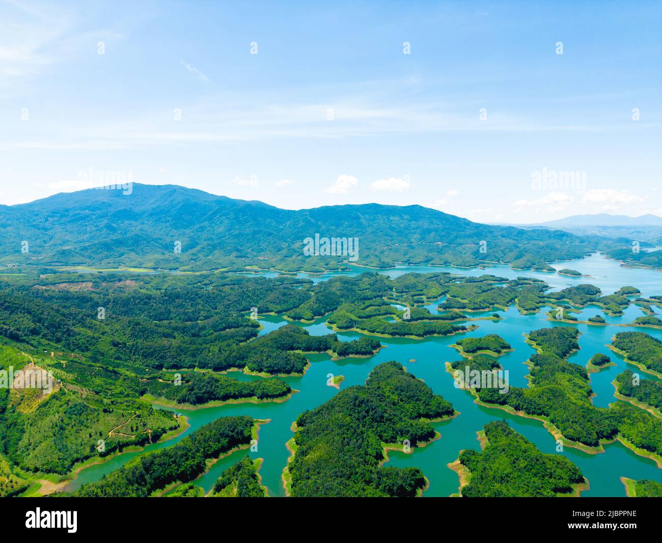 Morning at the Ta Dung lake or Dong Nai 3 lake with green hills and ...