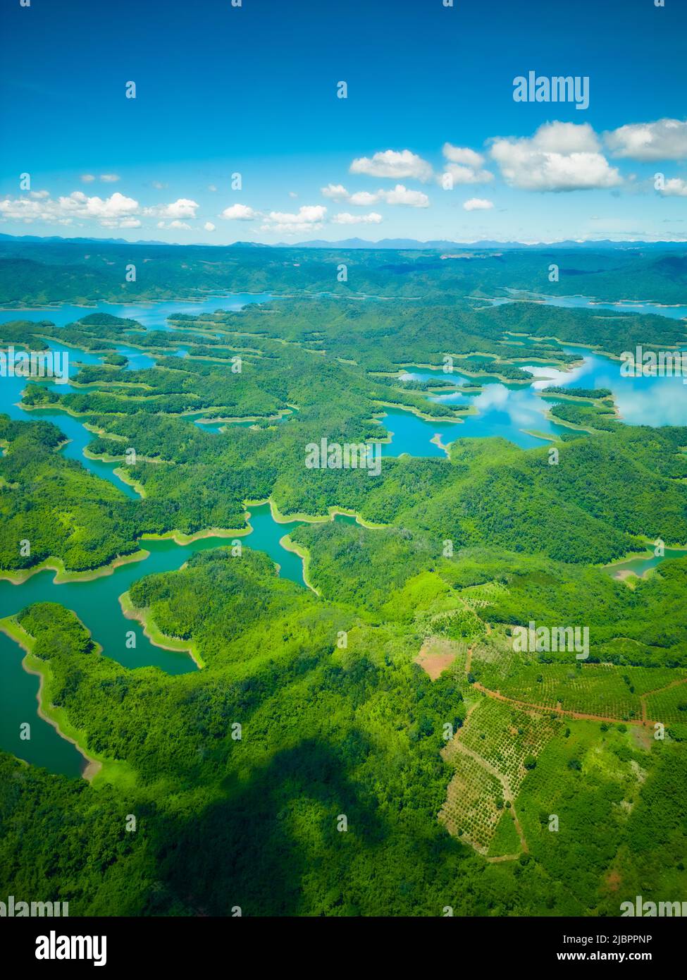 Morning at the Ta Dung lake or Dong Nai 3 lake with green hills and ...